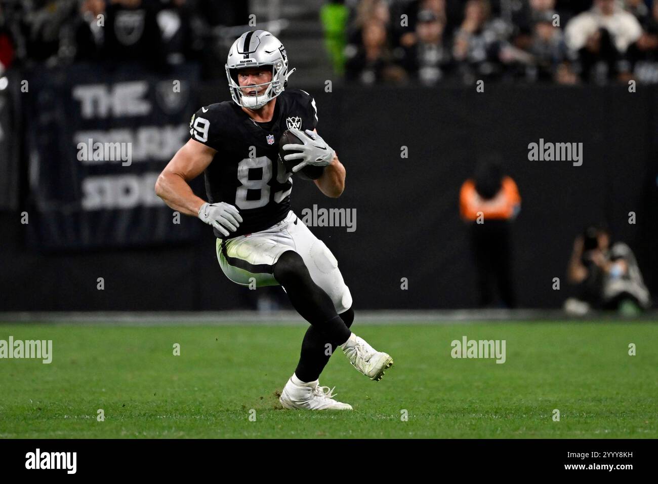 Las Vegas Raiders tight end Brock Bowers (89) carries the ball during an NFL football game ...