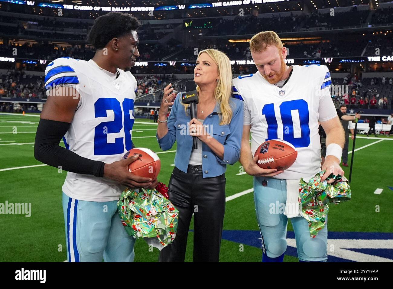 NBC broadcaster Melissa Stark, center, interviews Dallas Cowboys ...