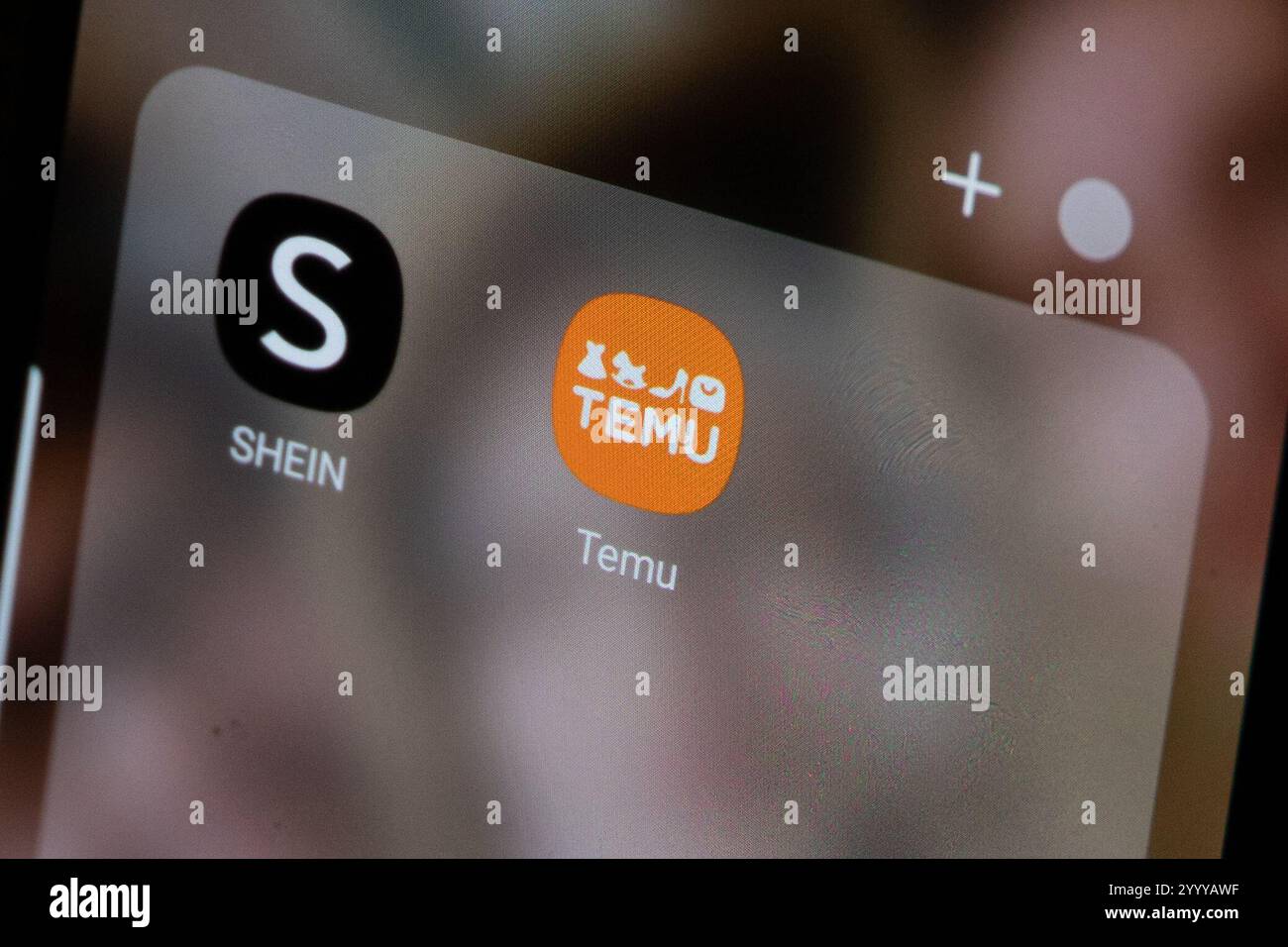 Denmark. 23rd Dec, 2024. In this photo illustration, a Temu and Shein logos seen displayed on a ...