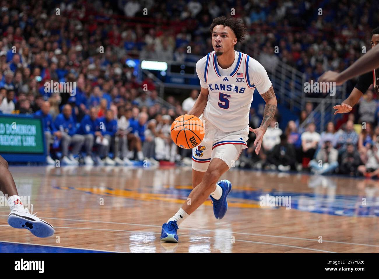 Kansas guard Zeke Mayo drives during the first half of an NCAA college ...