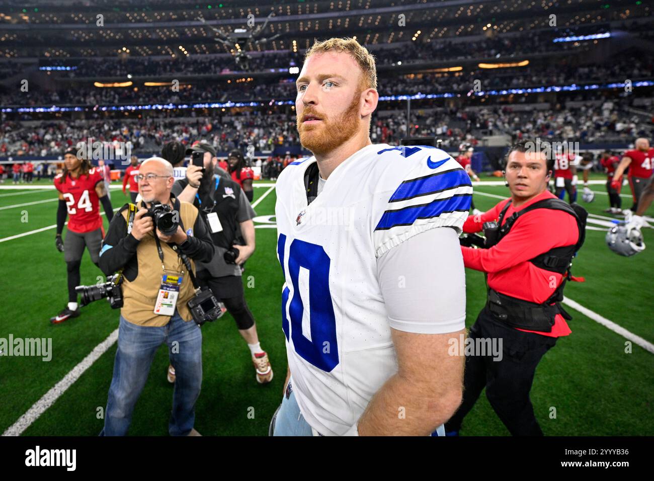 Dallas Cowboys quarterback Cooper Rush walks on the field following an ...