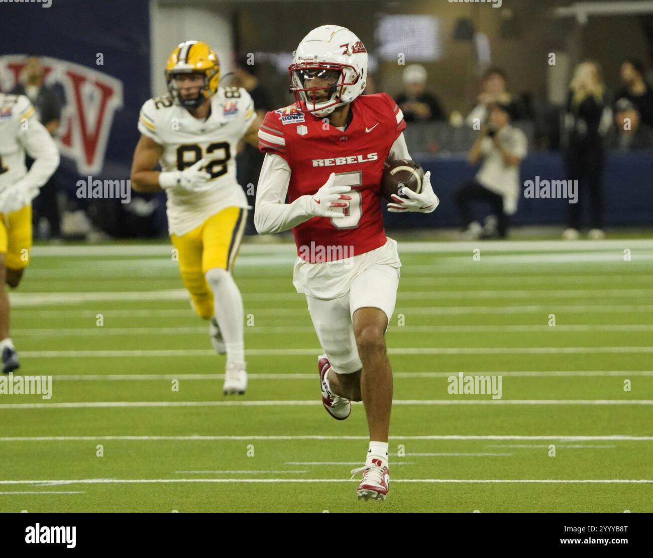 UNLV running back Greg Burrell (5) makes a play during an NCAA football ...