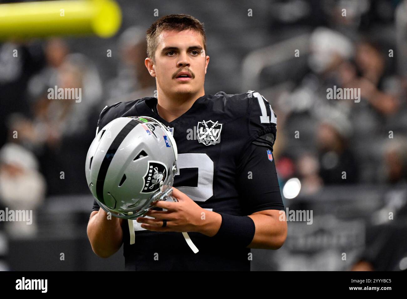 Las Vegas Raiders quarterback Aidan O'Connell (12) warms up before an NFL football game against ...