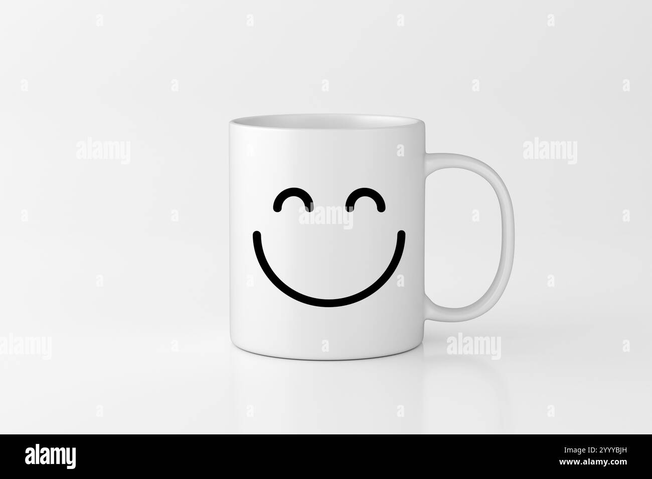 A white mug with a simple smiling face printed on it stands on a white ...