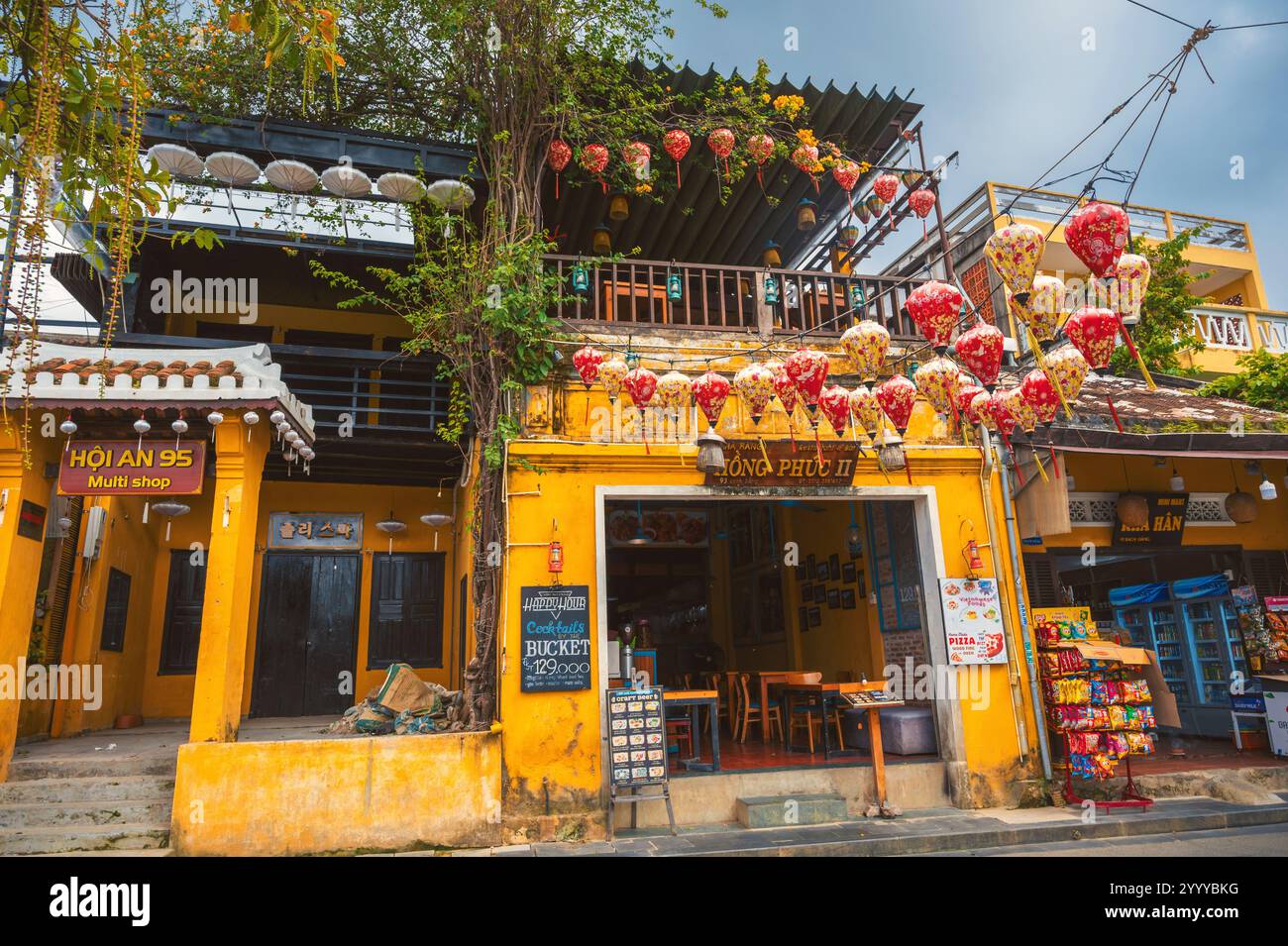 A quiet street decorated with colorful lanterns for the Vietnamese New ...