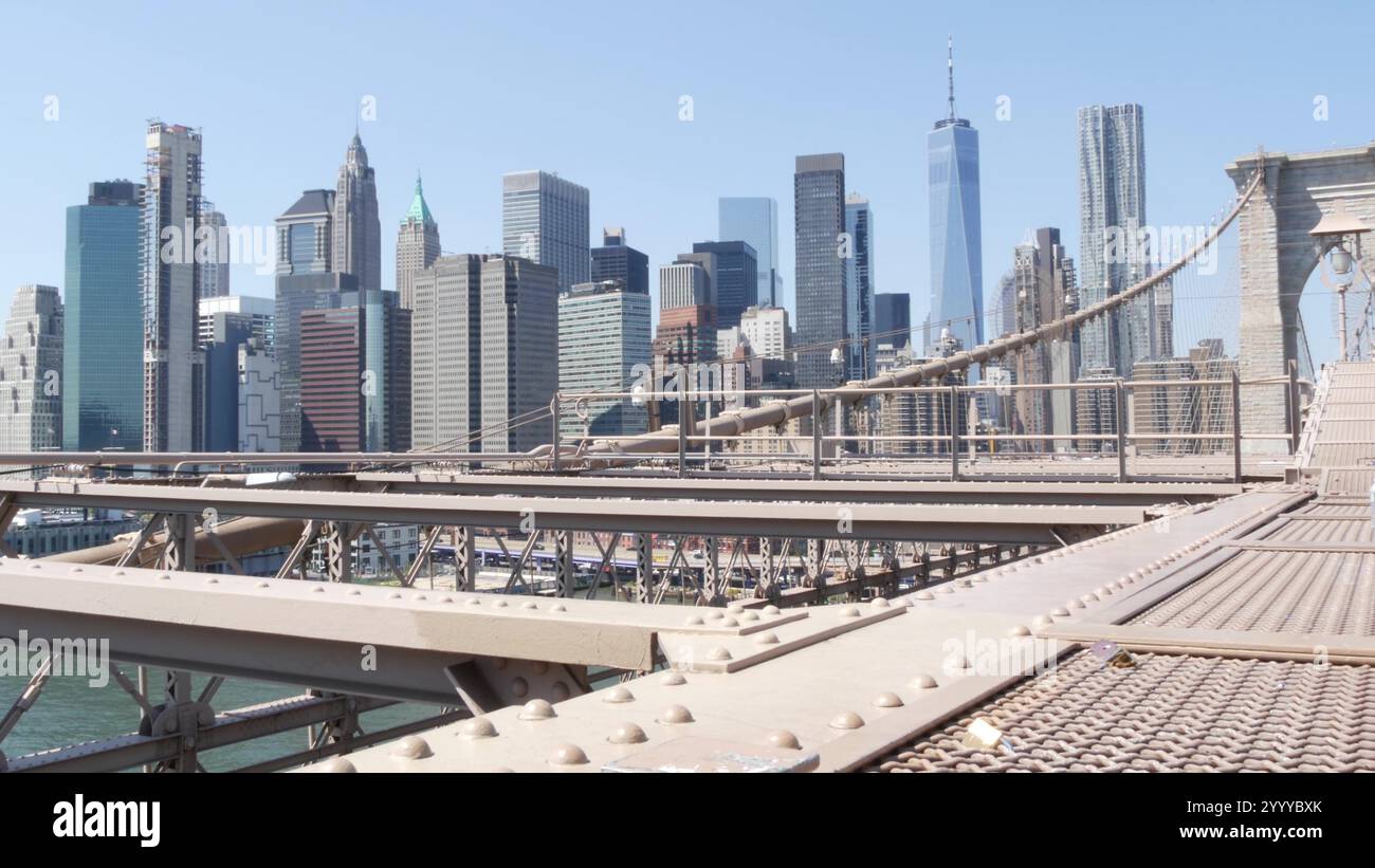 Brooklyn Bridge to Manhattan downtown. New York City skyline, financial ...