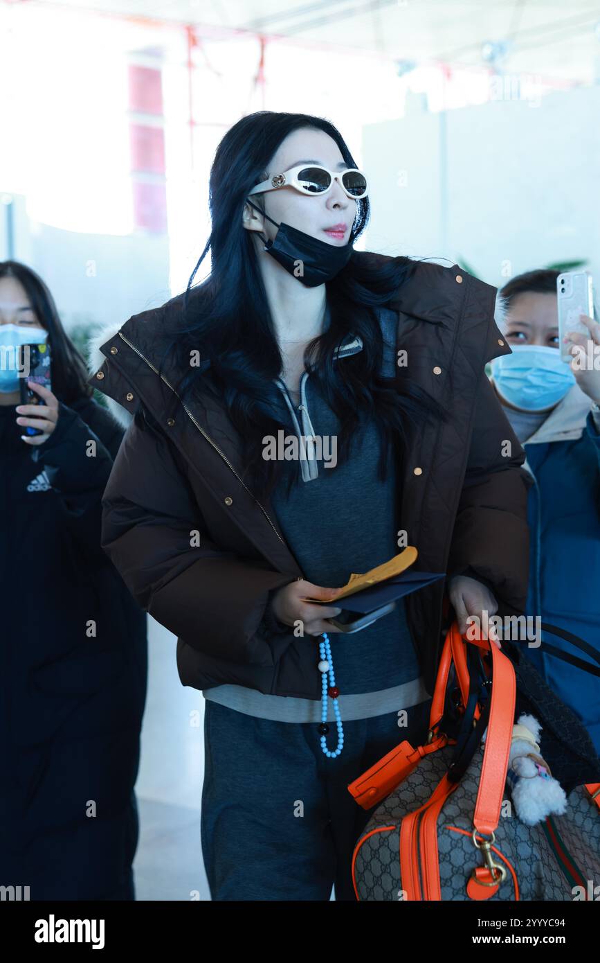Chinese actress Wang Churan appears at the airport in Beijing, China ...