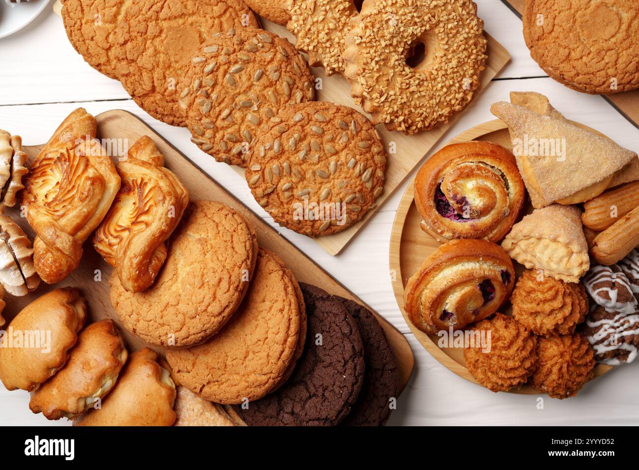 Delicious assortment of baked goods displayed on wooden platters ...