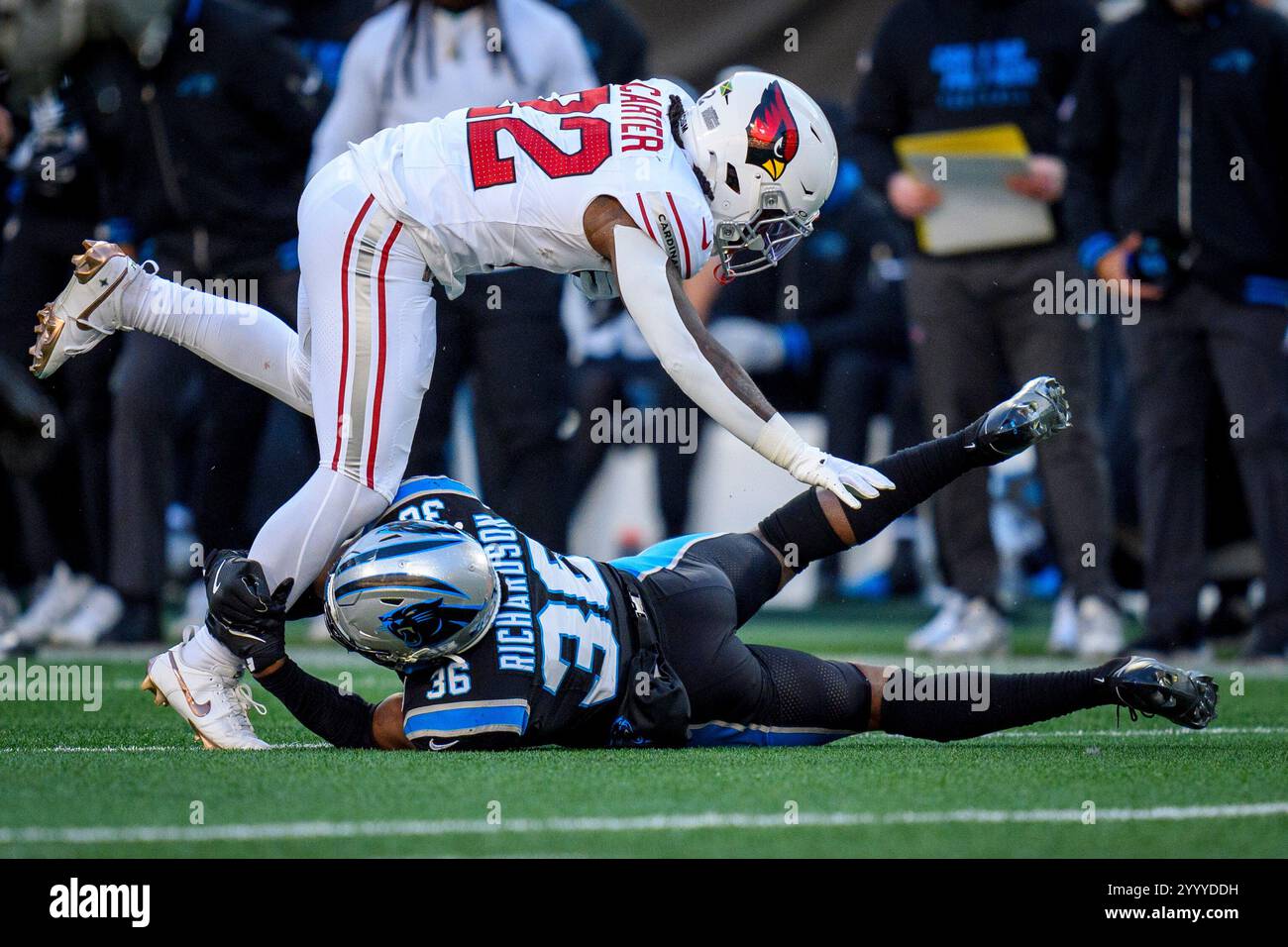Arizona Cardinals running back Michael Carter (22) is tackled by ...