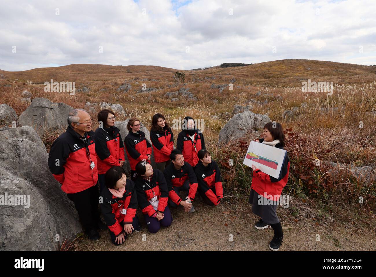 Guides listen to a geoguide, a geopark guide, at the Akiyoshi plateau ...