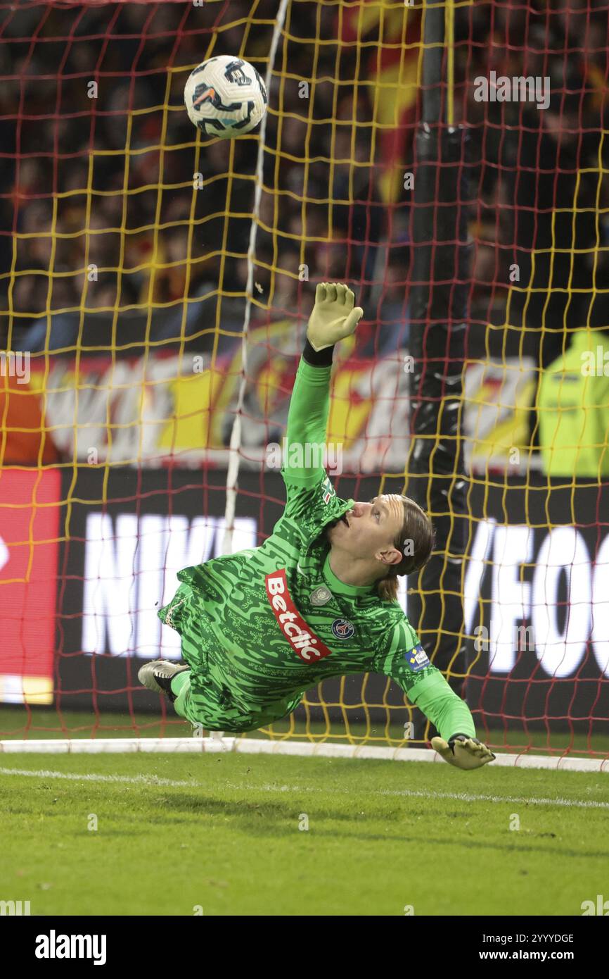 PSG goalkeeper Matvey Safonov stops a penalty during the penalty ...