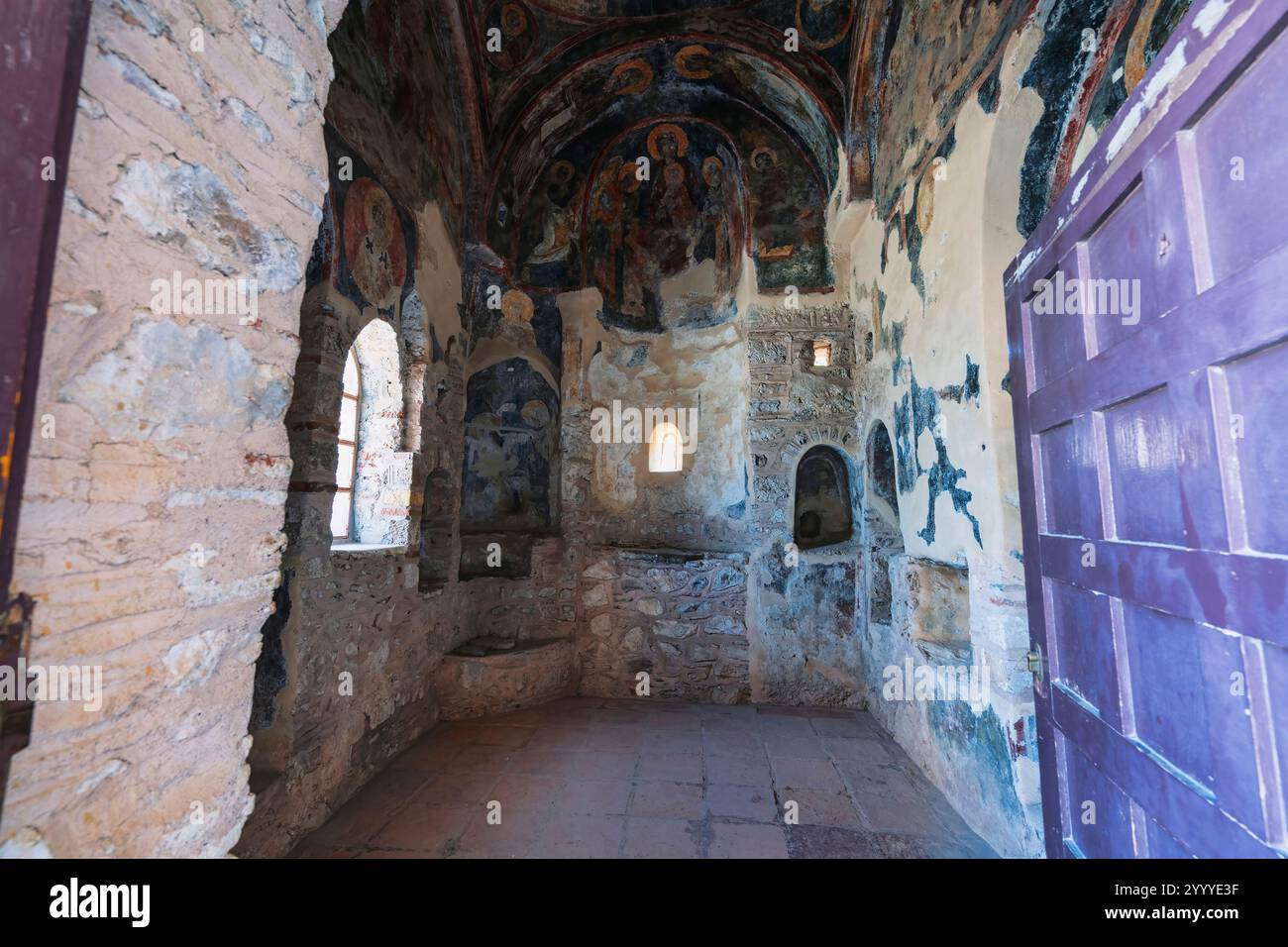 The interior of a chapel in Mystras, Greece, adorned with faded ...