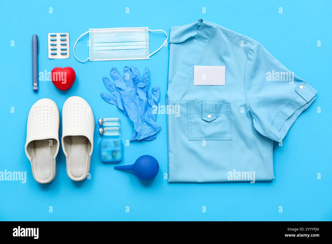 Medical student's uniform with supplies on blue background Stock Photo ...