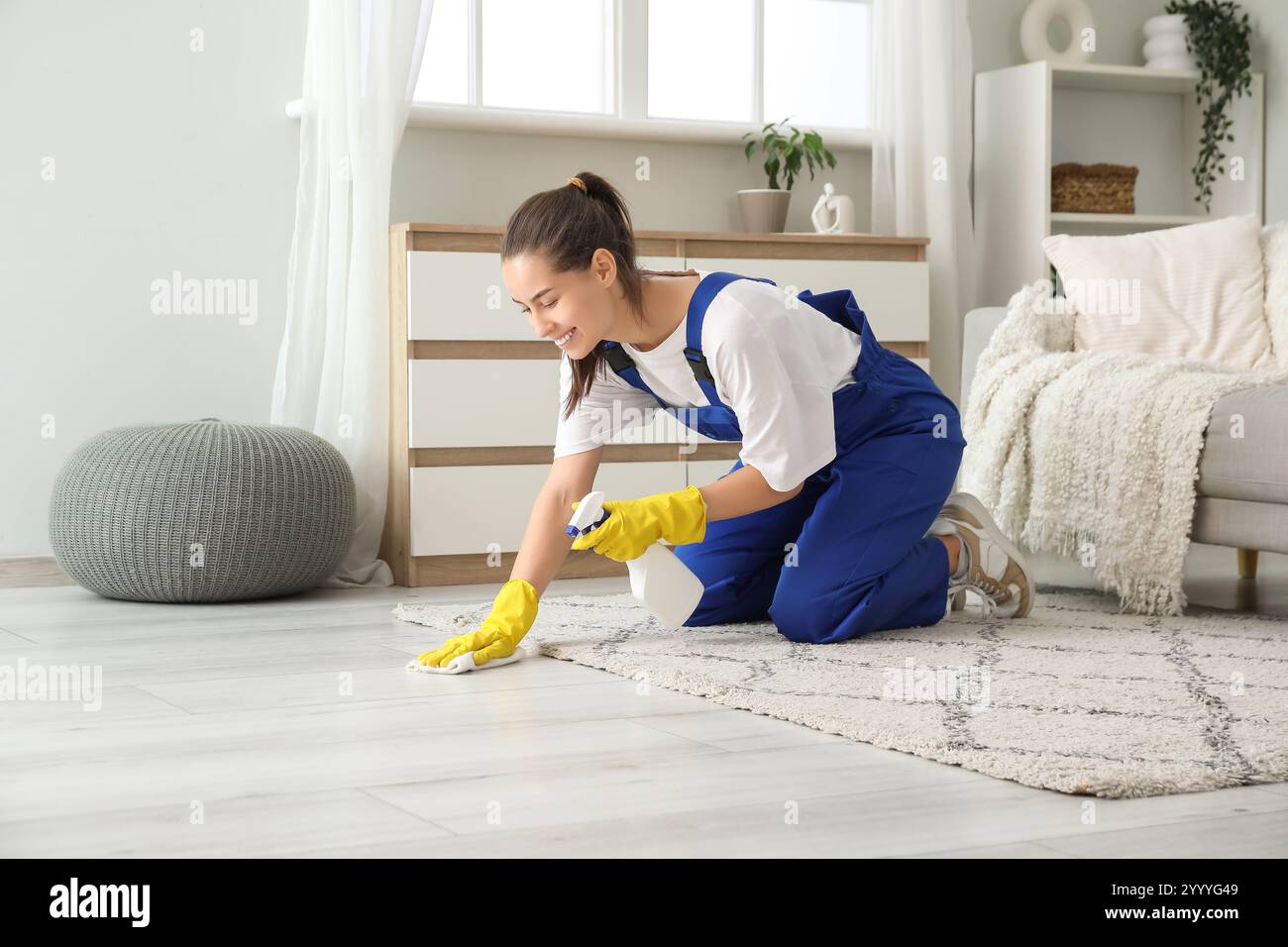 Female janitor cleaning floor in room Stock Photo - Alamy