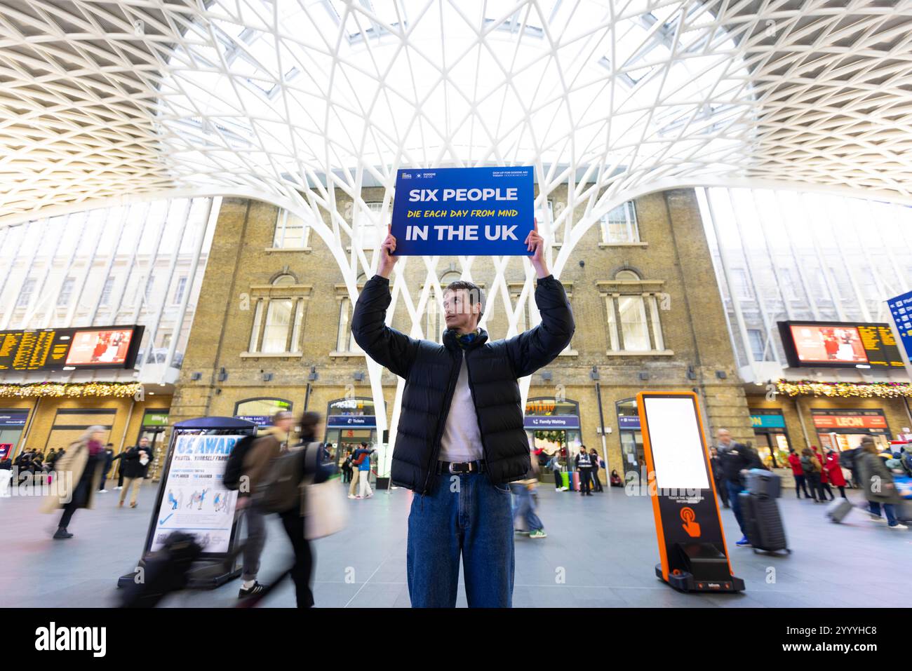 EDITORIAL USE ONLY Campaigner Sam Walker holds a sign at London's King ...