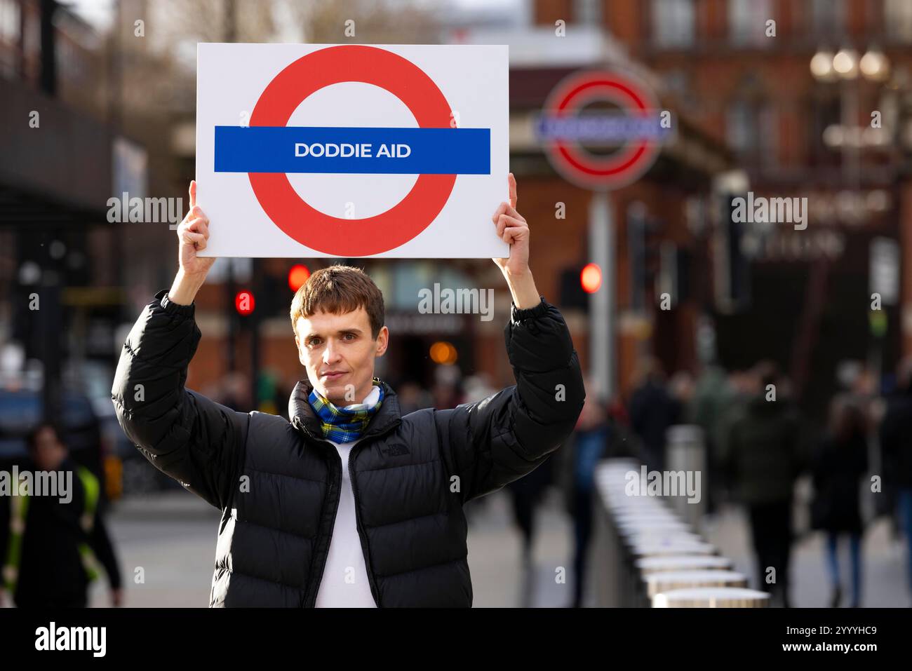 EDITORIAL USE ONLY Campaigner Sam Walker holds a sign at London's King ...