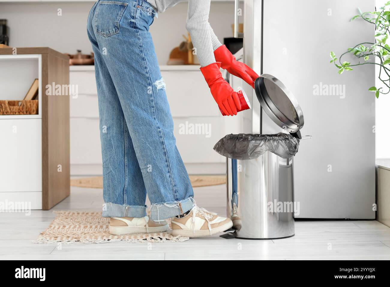 Girl throwing trash bin in hi-res stock photography and images - Alamy