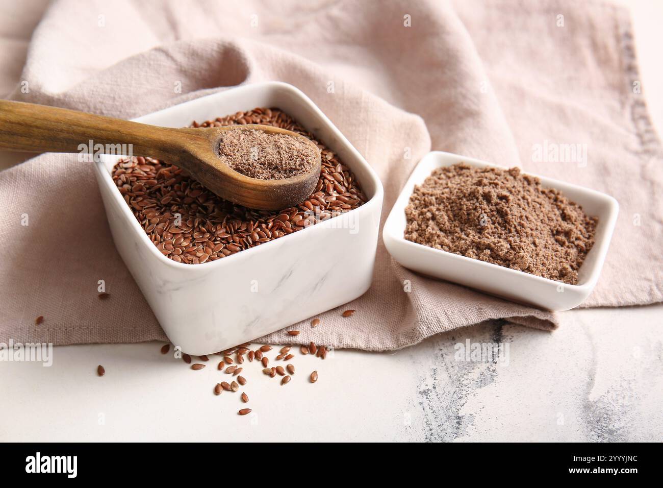 Bowls of flax seeds and flour on white background Stock Photo - Alamy