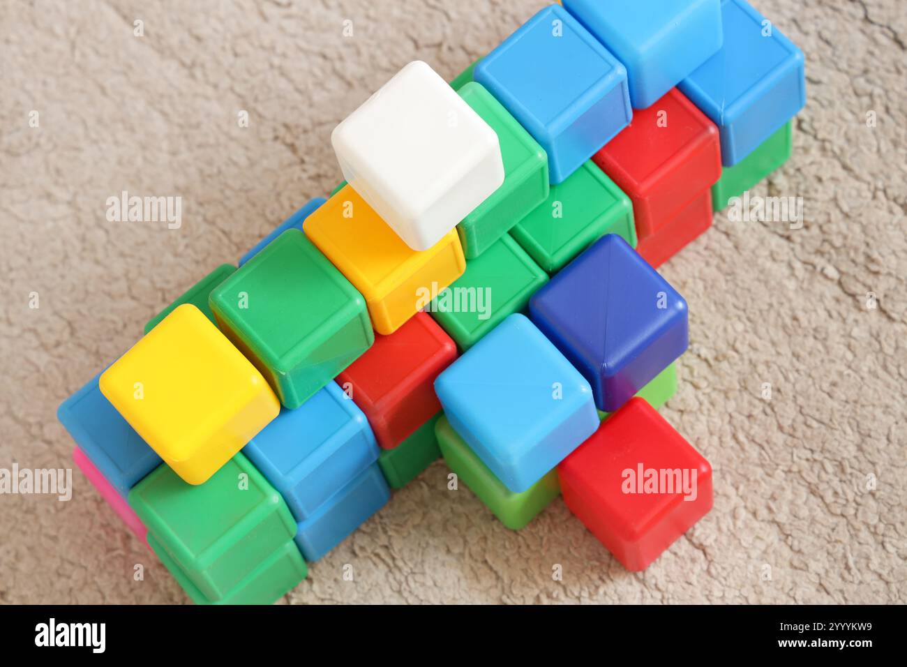 Colorful cubes on carpet in children's room, closeup Stock Photo - Alamy