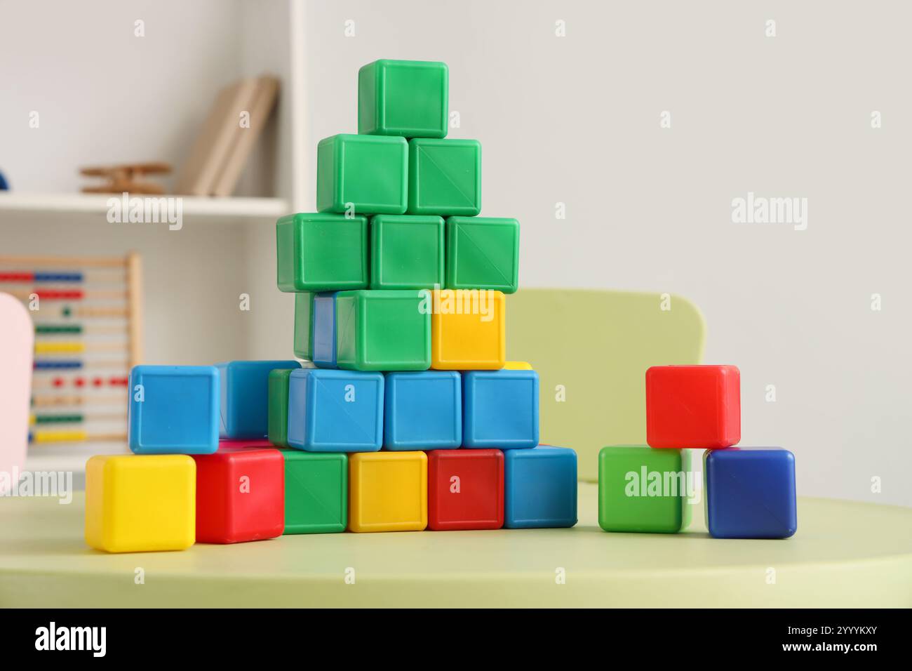 Colorful cubes on table in children's room Stock Photo - Alamy