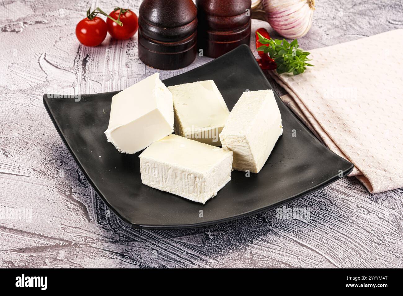 Greek traditional cuisine - Feta cheese bricks Stock Photo - Alamy
