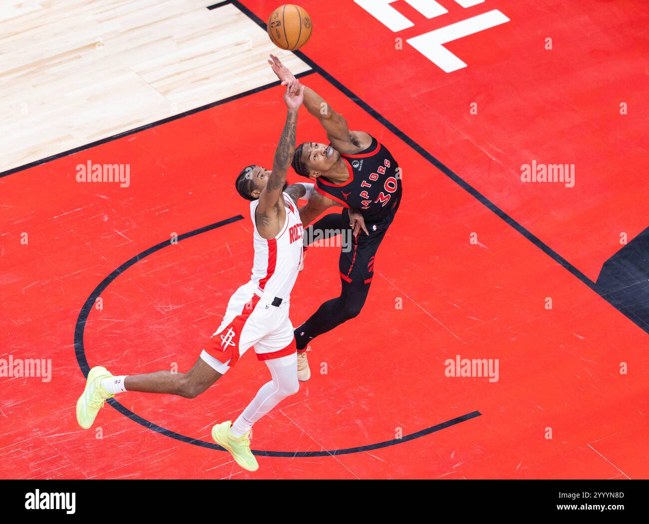 Toronto, Canada. 22nd Dec, 2024. Ochai Agbaji (R) of Toronto Raptors ...