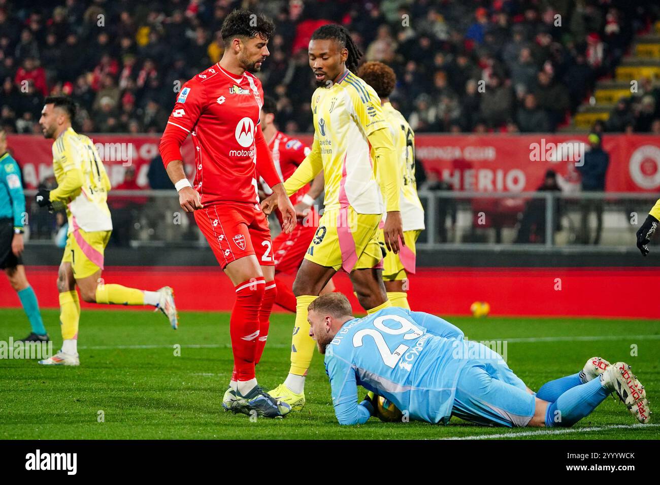 Monza, Italy. 22nd Dec, 2024. Michele Di Gregorio (Juventus FC) and Pablo Mari (AC Monza) during ...