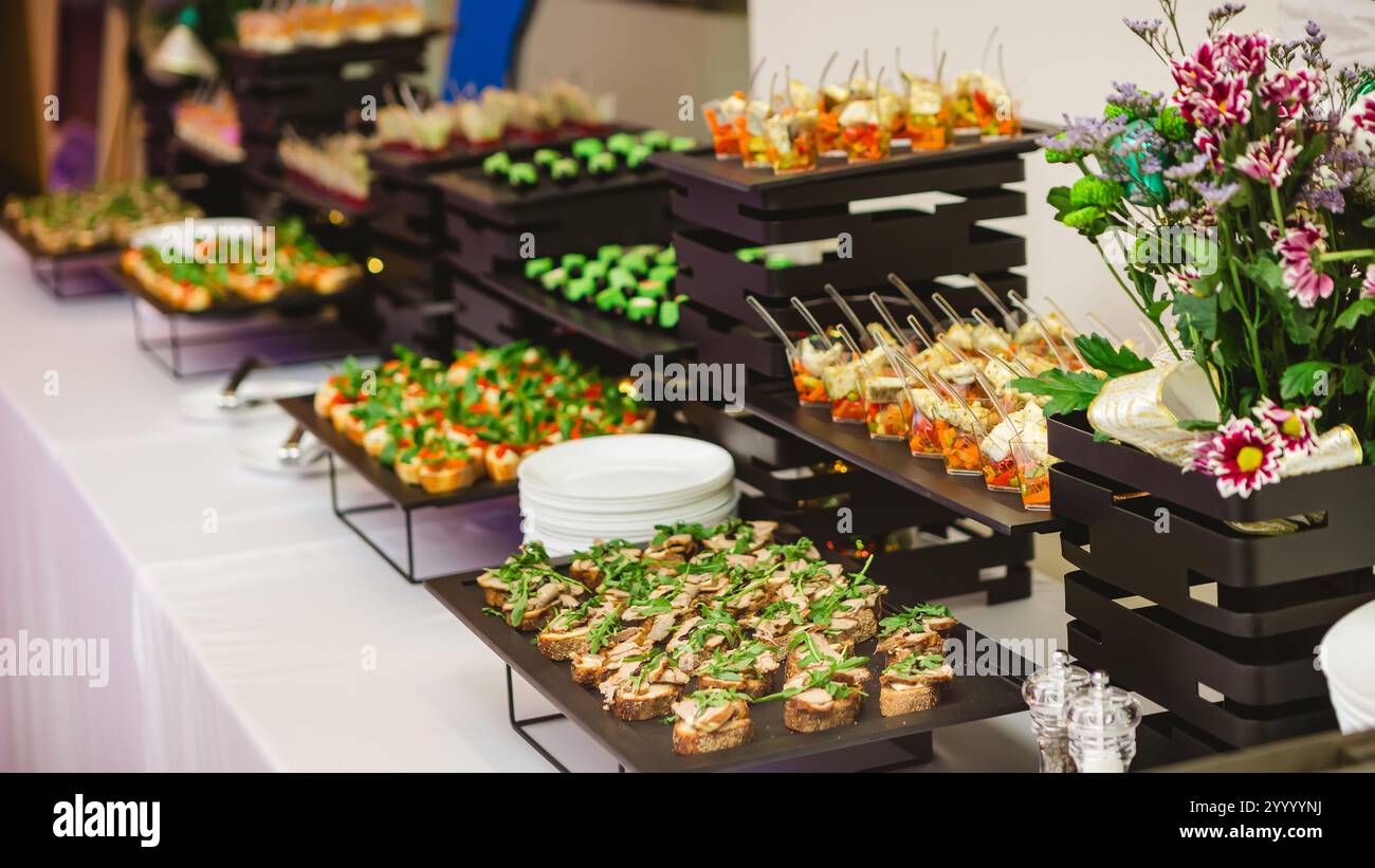A contemporary hotel dining area featuring a sleek buffet setup Stock ...