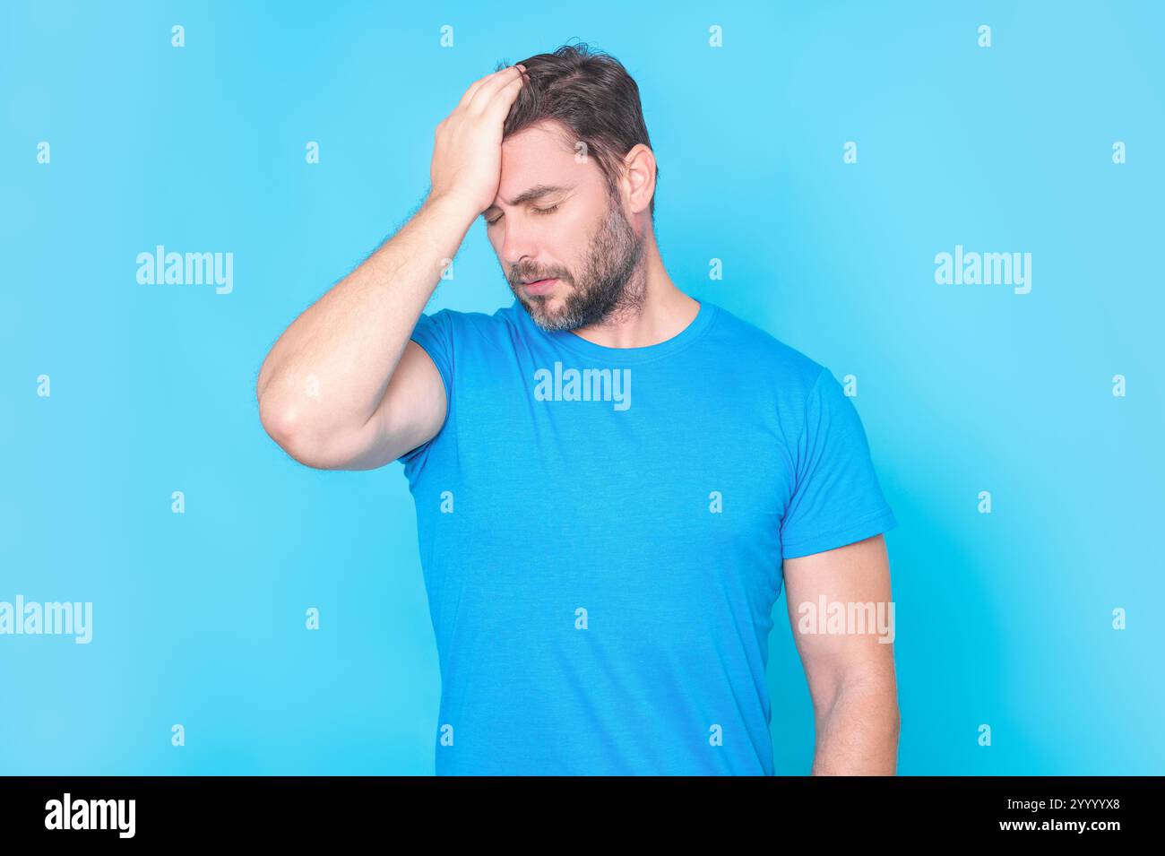 Man with headache, studio isolated portrait. Tired man having headache ...