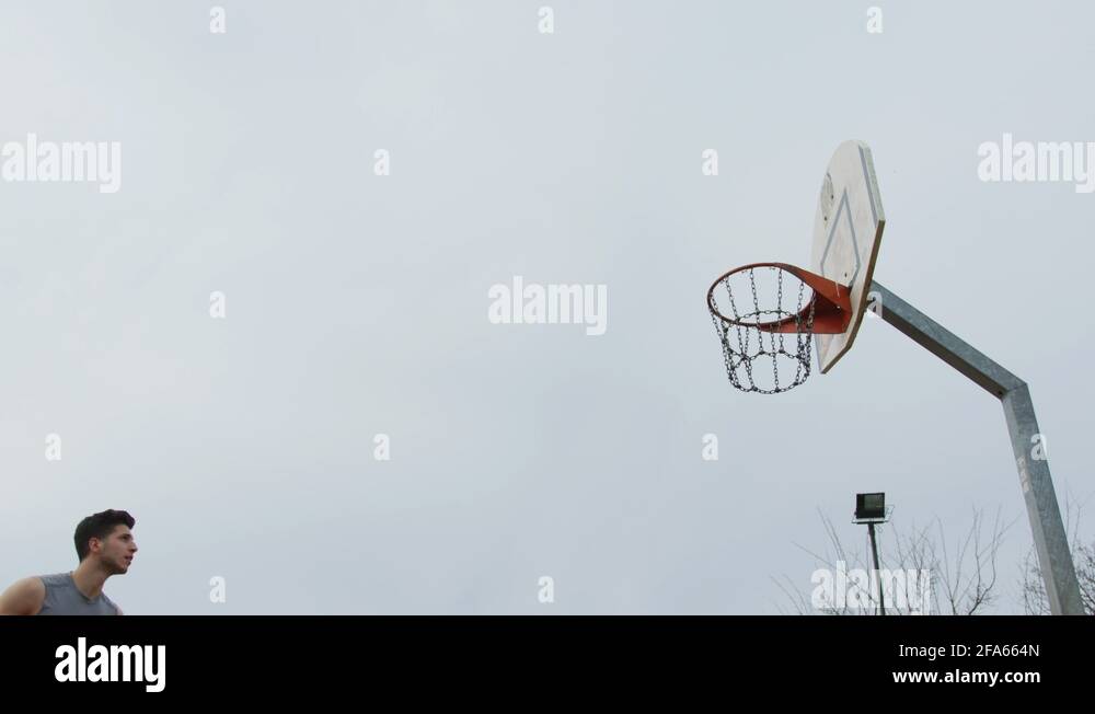 Man shooting basketball in the hoop Stock Video Footage - Alamy