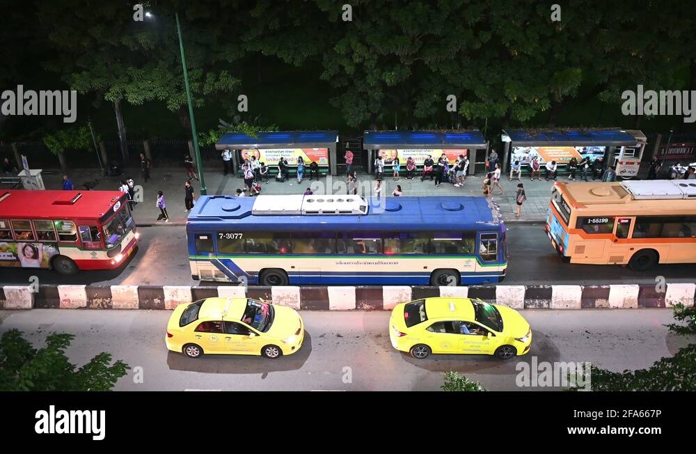 4K Top view of people waiting bus at bus station on night time Stock ...