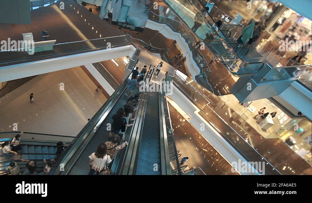 Shopping mall crowd of people on escalators. Consumption concept. Rush hour Stock Video Footage ...
