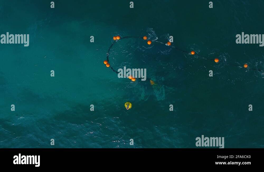 drone above the structure of an oil rig submarine cable station laying ...