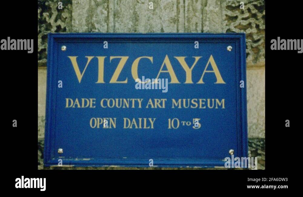 1950s: UNITED STATES: Vizcaya Dade County Art Museum sign. Man stands ...