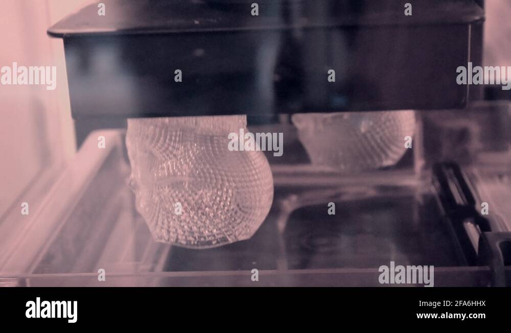 Stereolithography DPL, SLA 3d printer creating shape by UV ...
