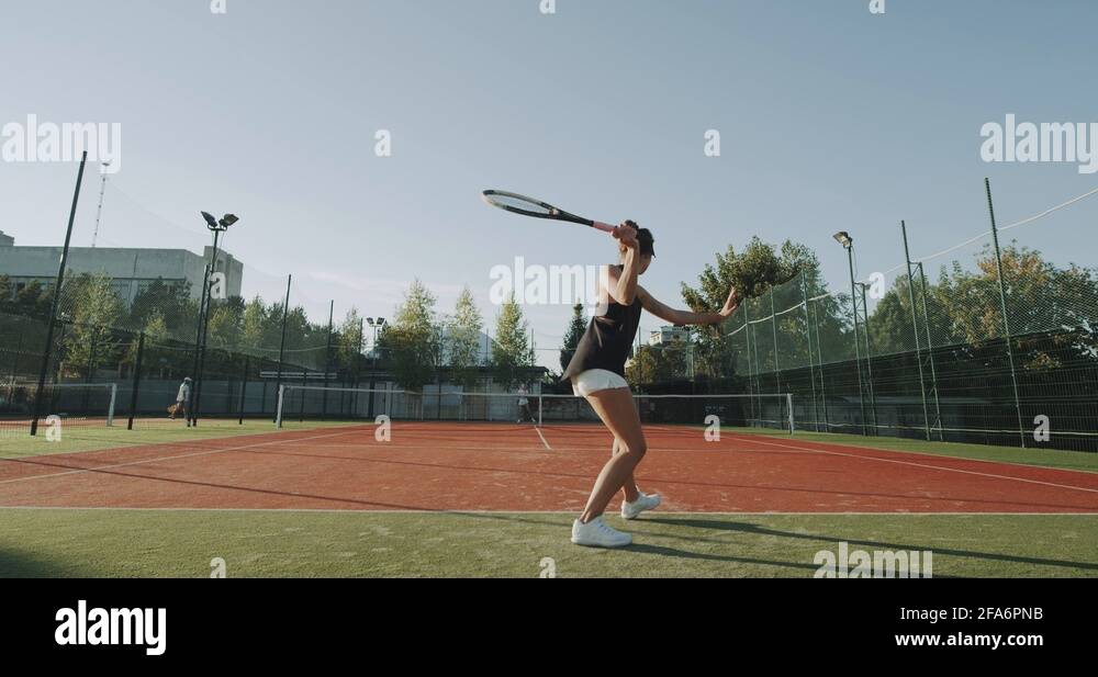 Tennis game on full tennis court playing professional two ladies Stock ...