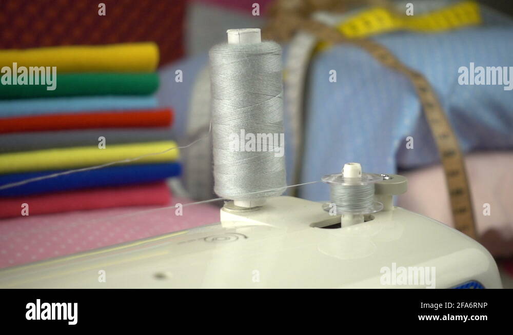 Thread is unwound from the reel during sewing to other coil in slow ...