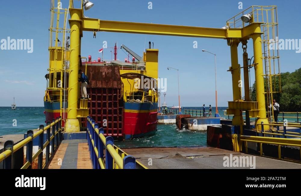 Ferry boat sails from the pier of Bali Island, Indonesia. Indonesian ...
