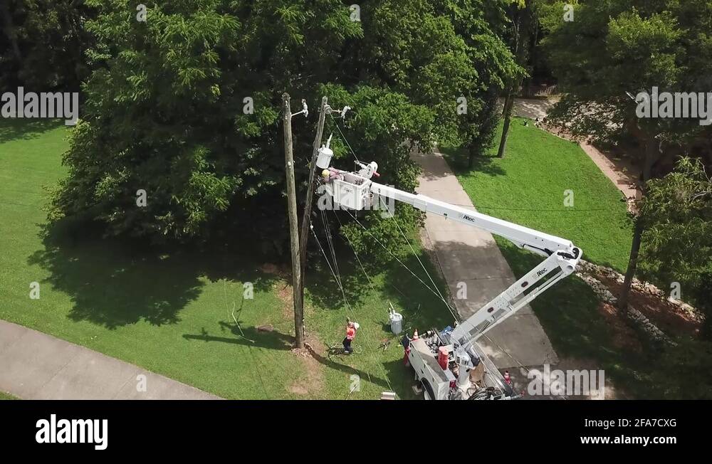 Workmen repairing and re-wiring utility pole Stock Video Footage - Alamy