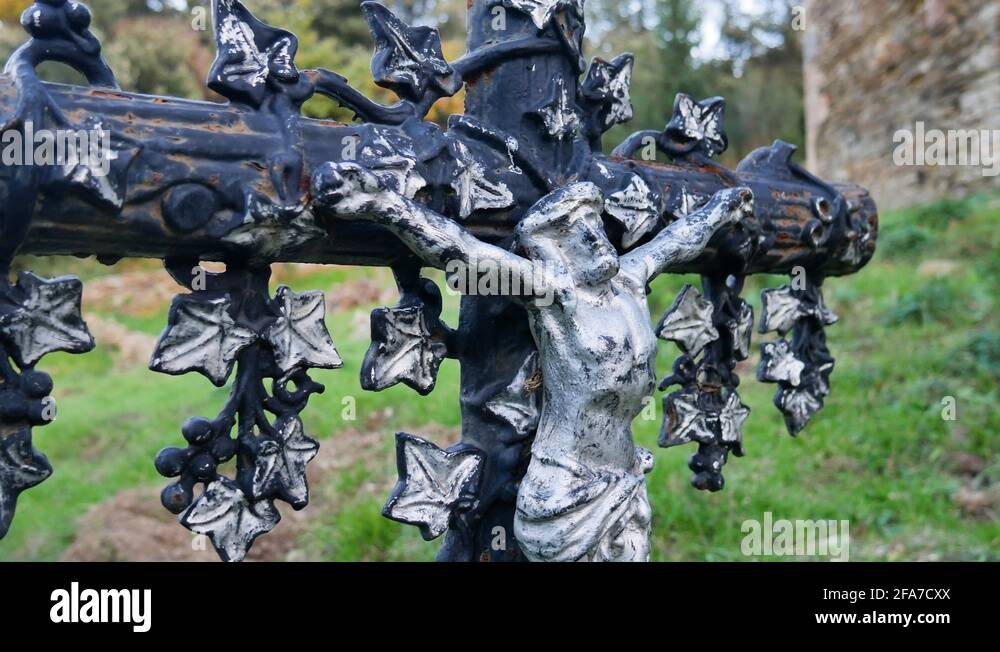 View from the side of a Christian cross grave made of wood and iron ...