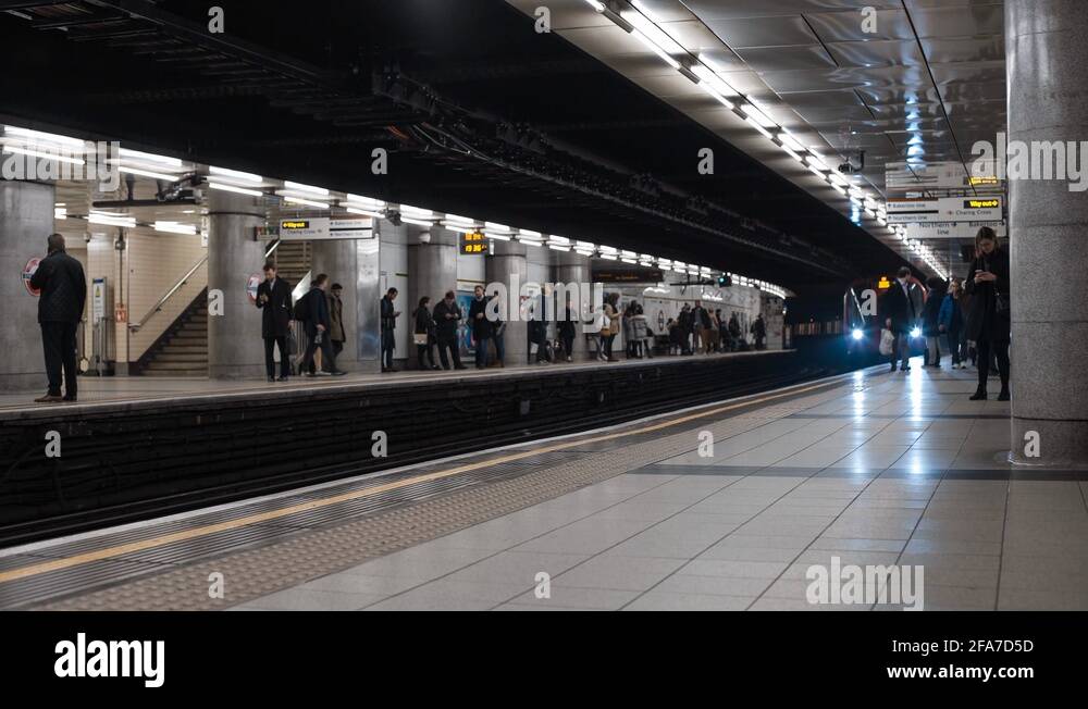 London underground rail close up subway tube arriving in the station ...