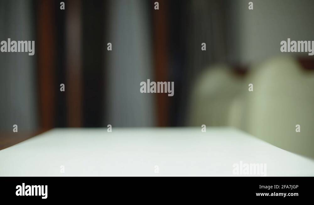 Slow slide panning left footage of three wide range zoom lenses indoor ...