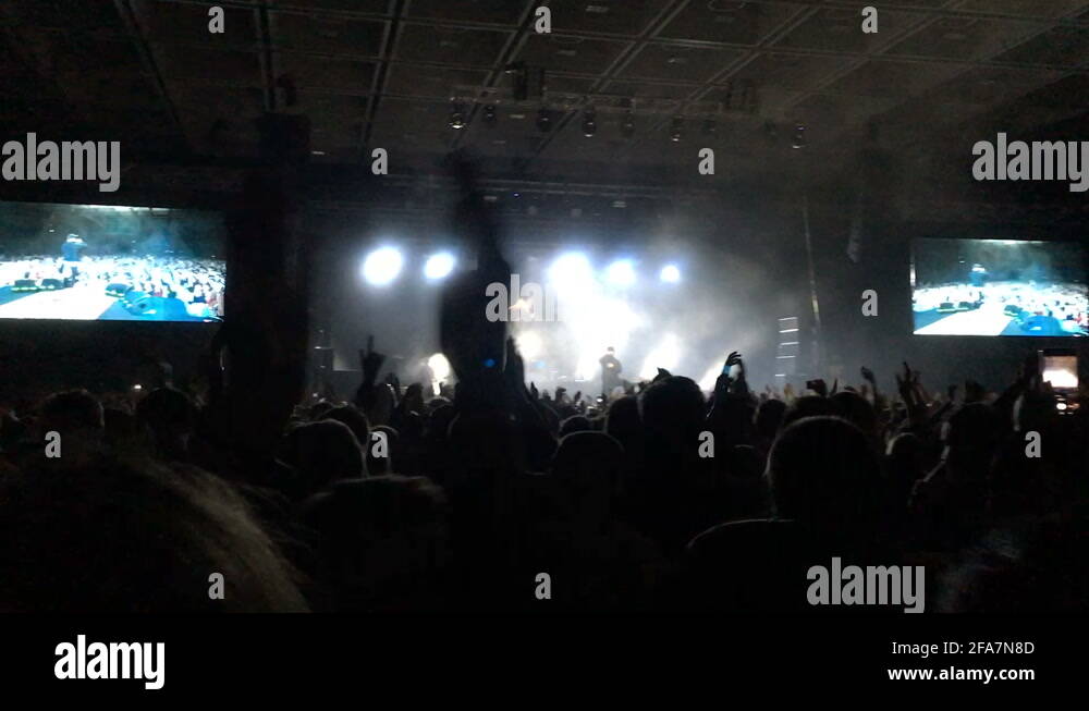 Women at concert in crowd clap closeup. Rock or rap concert. Silhouette ...