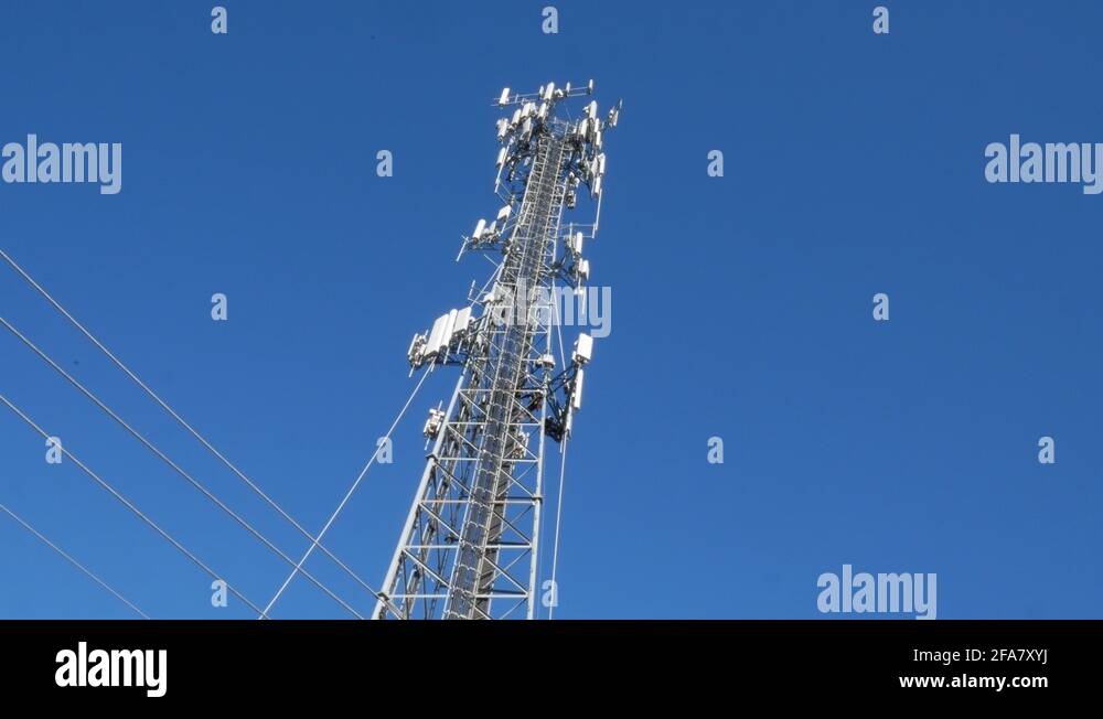 Wide Shot Workmen High On Cell Tower Fixing Problem, Blue Sky ...