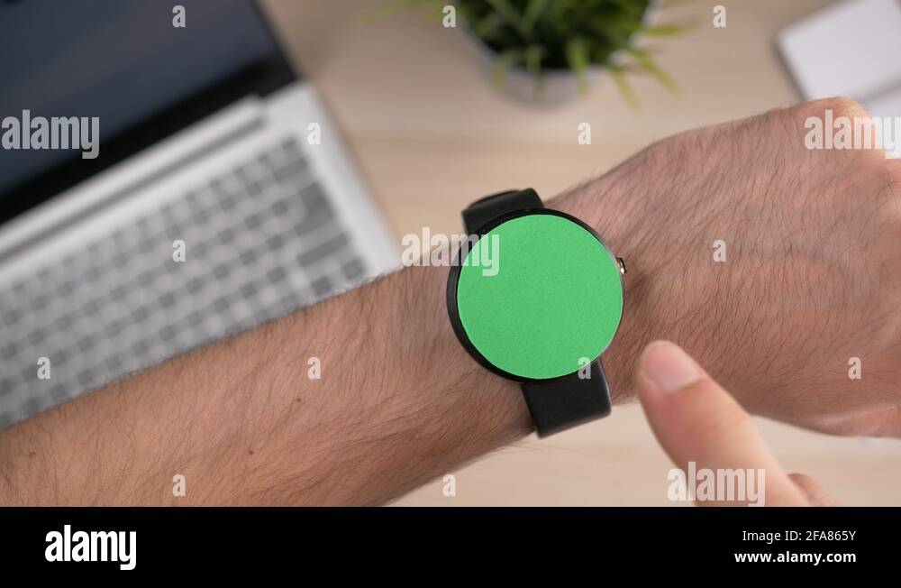 Using a Smartwatch With Green Screen at Office Stock Video Footage - Alamy