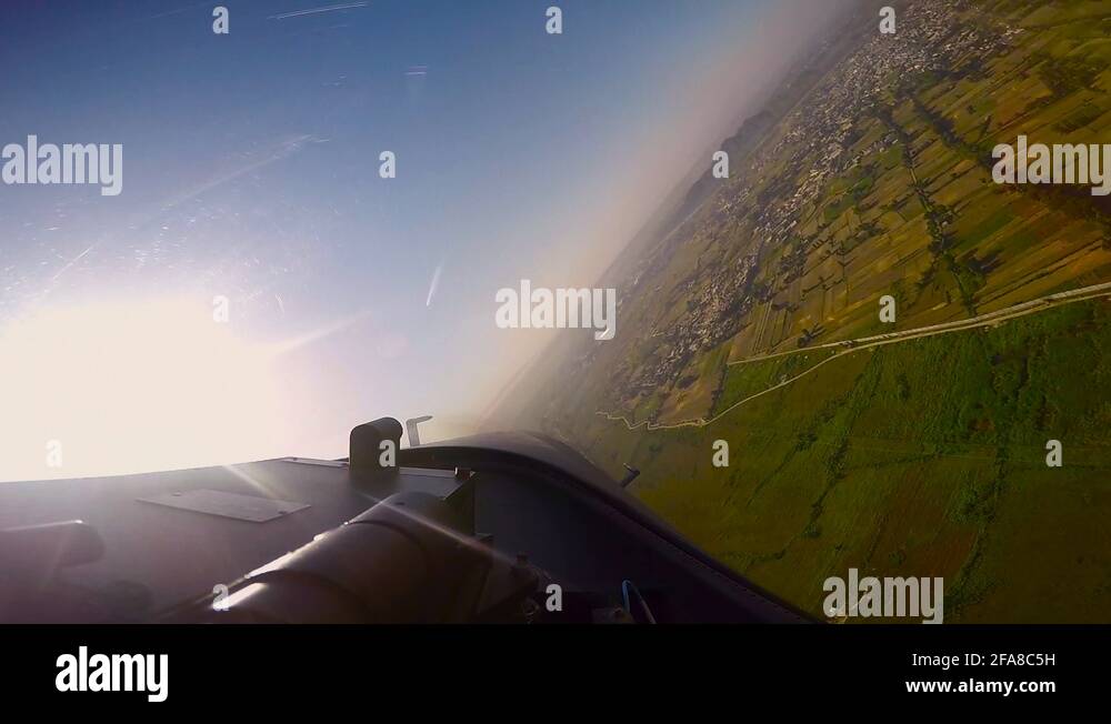 Fighter jet full rotation in the sky, low passing to the ground ...