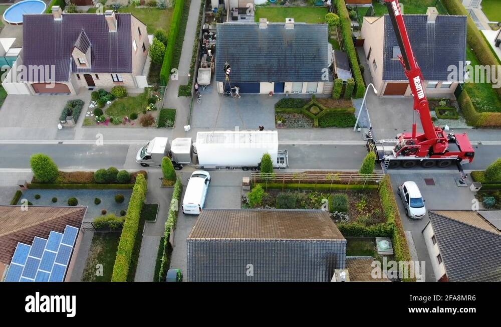 Lifting a swimming pool over a rooftop of a house part 2 Stock Video ...