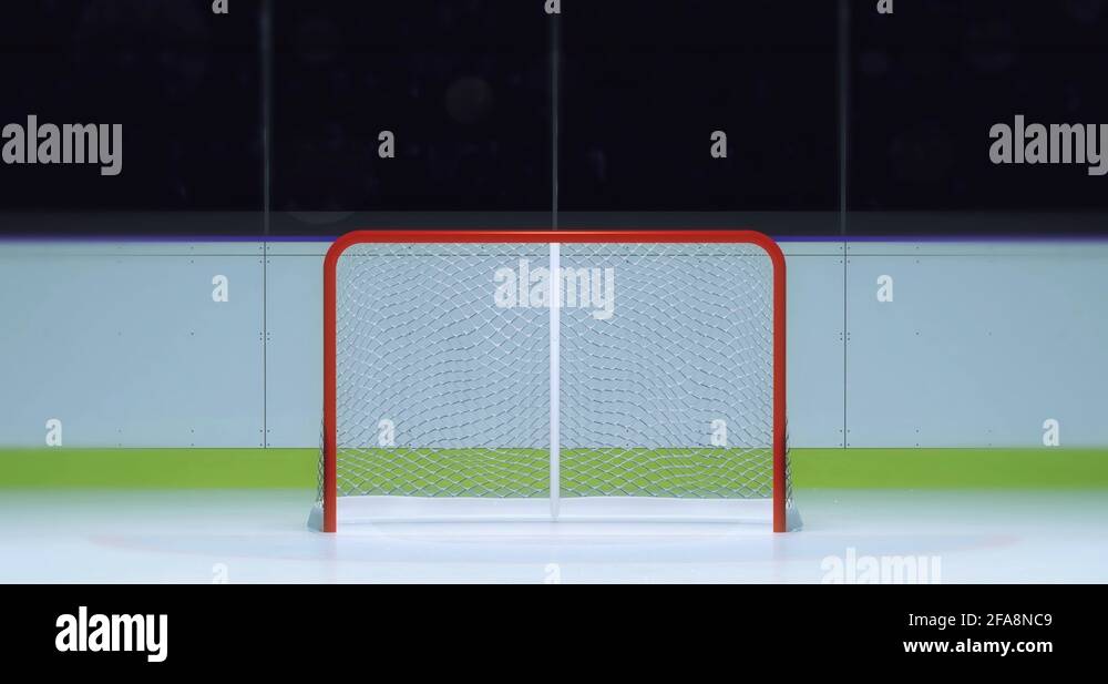 ice hockey rink with goalkeeper space fron view and camera flash behind ...