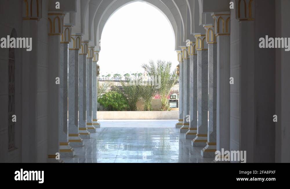 White colonnade with arches in the mosque. Buildings and architecture ...