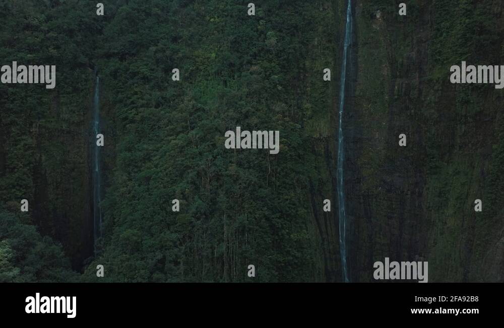 Two stunning waterfalls cascading over dramatic vertical cliff faces of ...